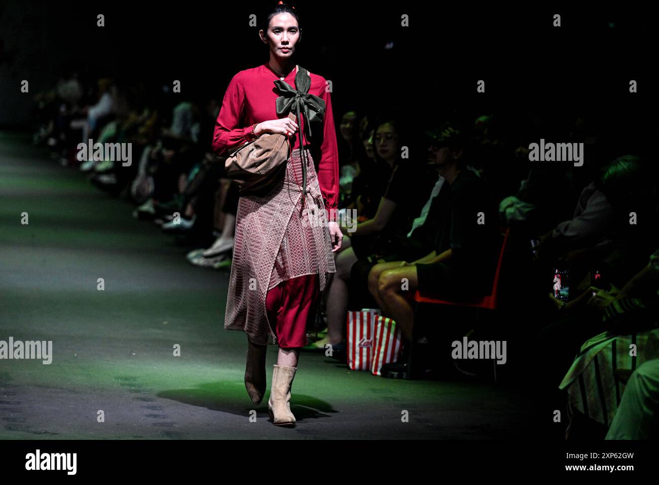 Tangerang, Indonesia. 3rd Aug, 2024. A model presents a creation of ...