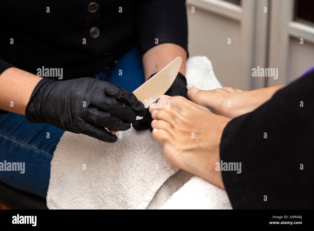 Nail polishing. Pedicure session at beauty salon. Close up view Stock ...