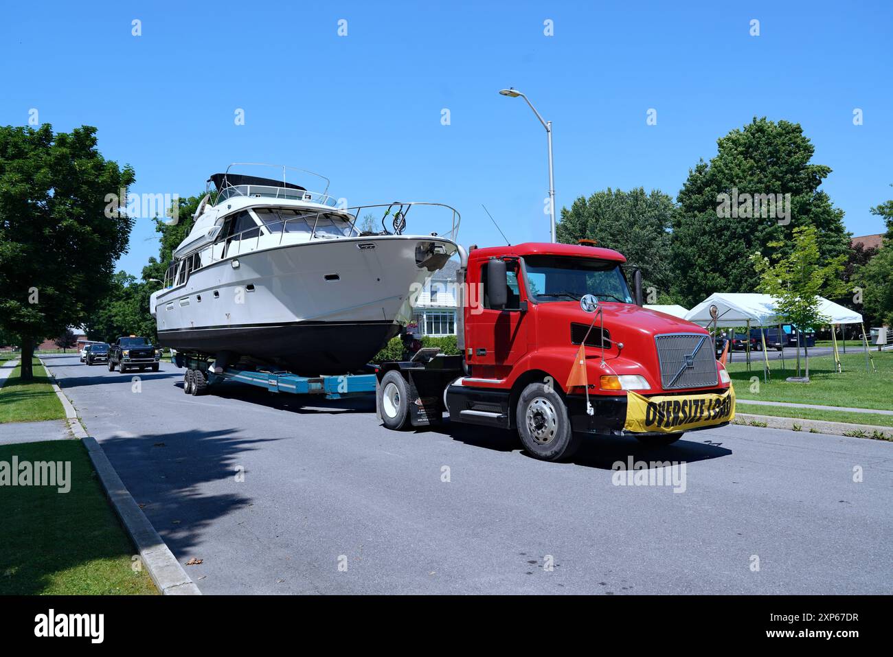 Heavy truck towing a large boat to the water Stock Photo - Alamy