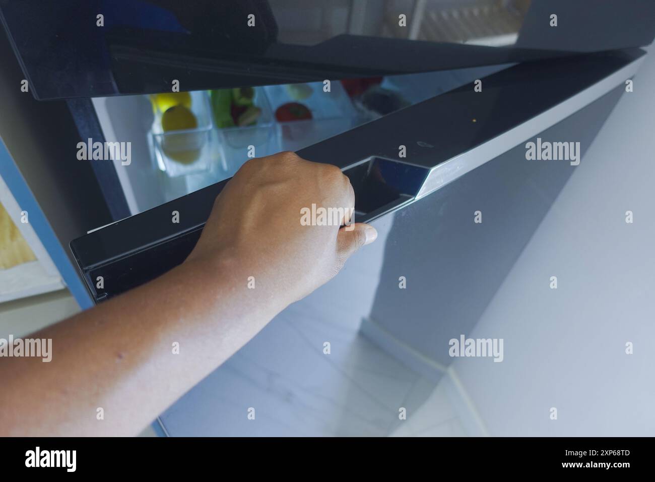 half open fridge with food and vegetables Stock Photo - Alamy
