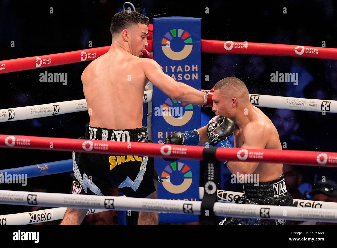 Jose Valenzuela, left, fights Isaac Cruz during a super lightweight championship boxing match in ...