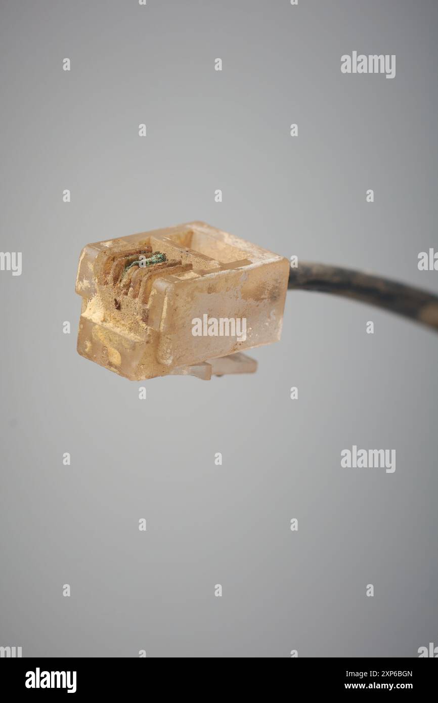 old dirty and rusty rj11 telephone connector plug isolated gray ...