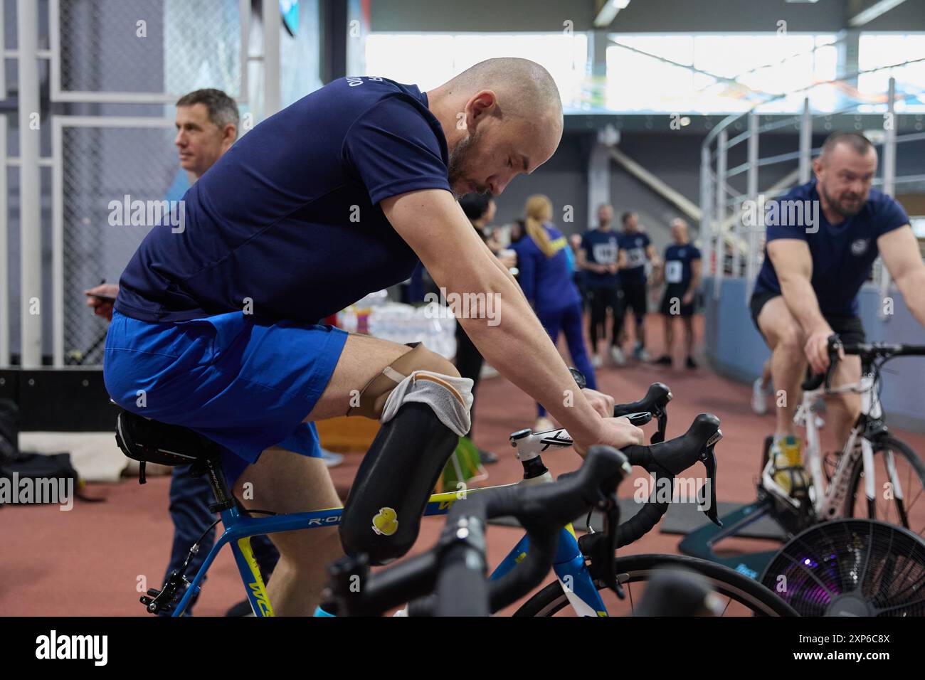 Veteran with amputation cycling on a bike stand at Air Force Trials ...