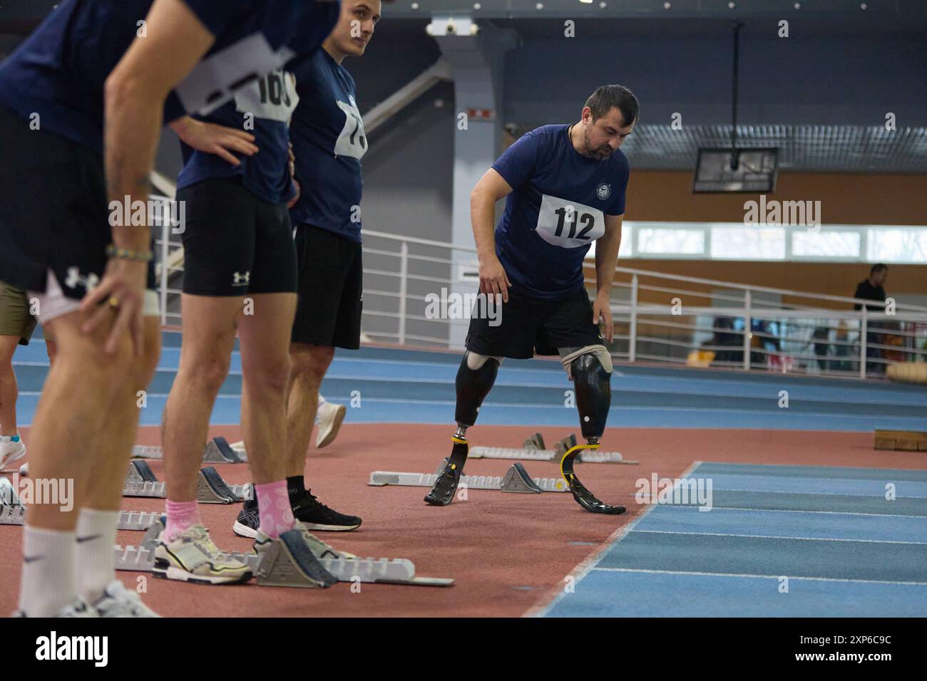 Athlete with amputated legs practices running on prosthetic limbs. Kyiv ...