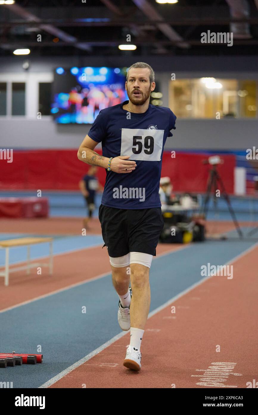 Athlete with amputation running a marathon on a track. Wounded ...