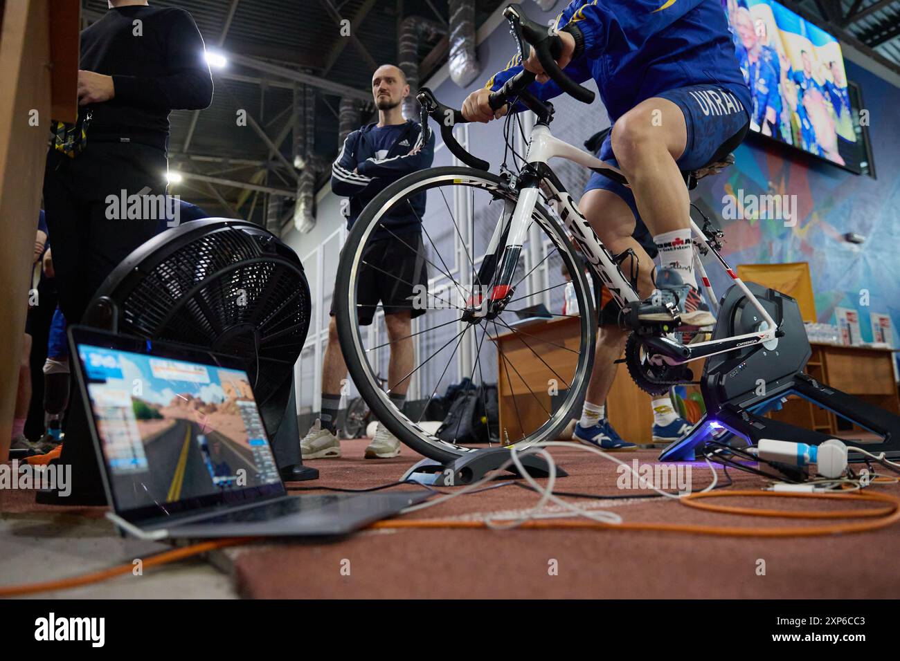 Wounded warrior cycling indoors at Air Force Trials competition. Kyiv ...