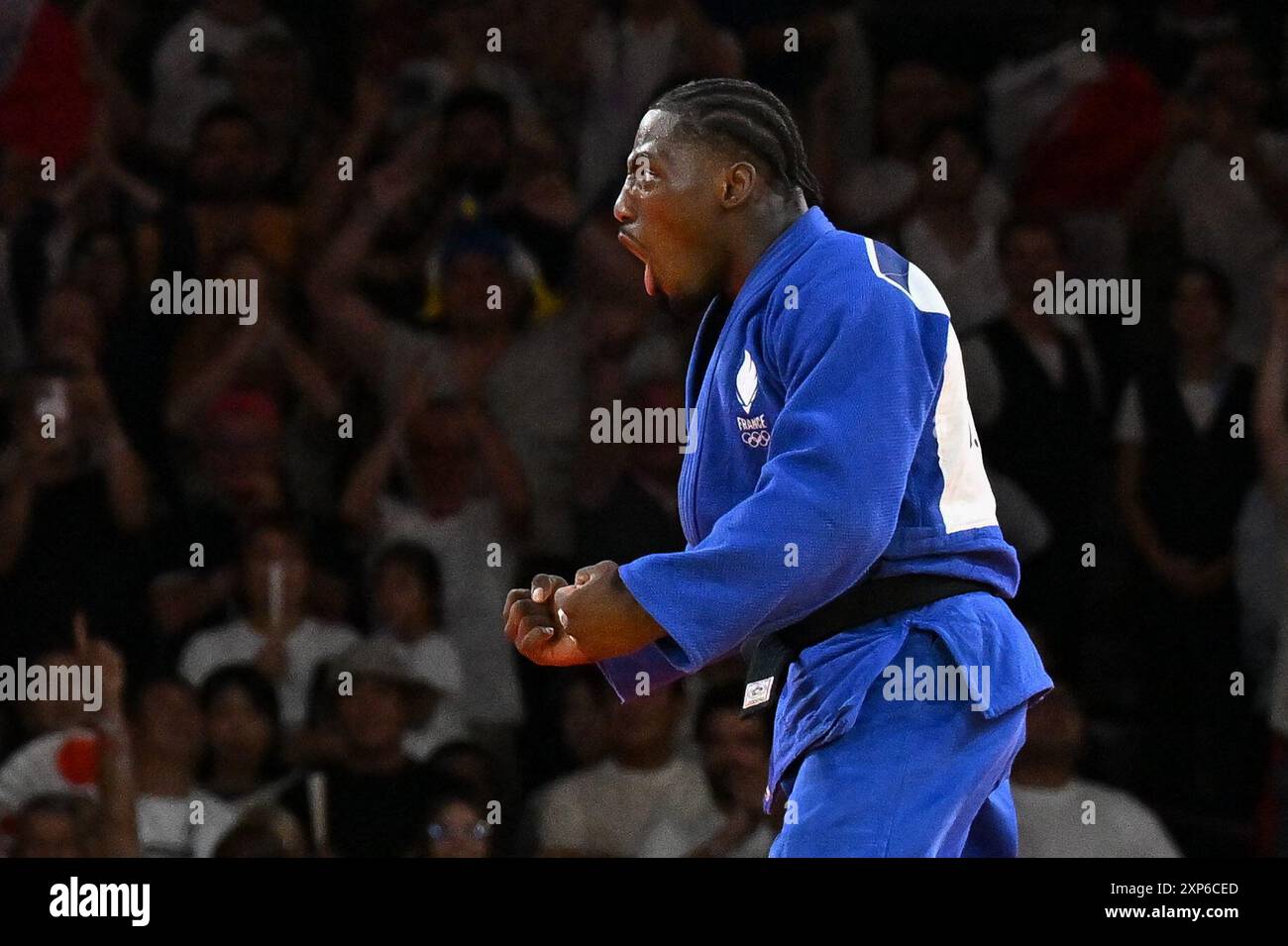 Joan-Benjamin Gaba (blue) of Team France celebrates his victory against ...