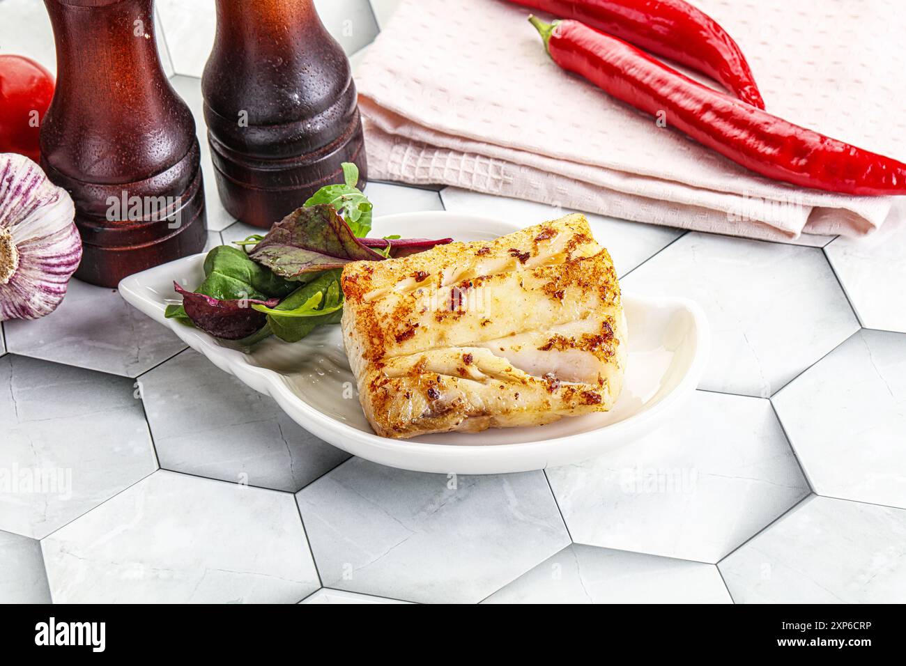 Roasted cod fish steak with salad leaves Stock Photo - Alamy