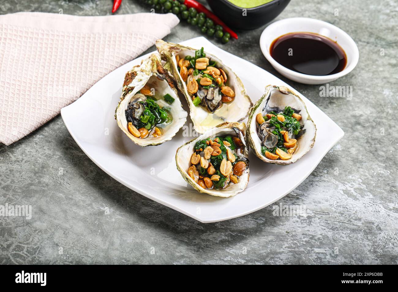 Open half oysters with green onion and peanut Stock Photo - Alamy