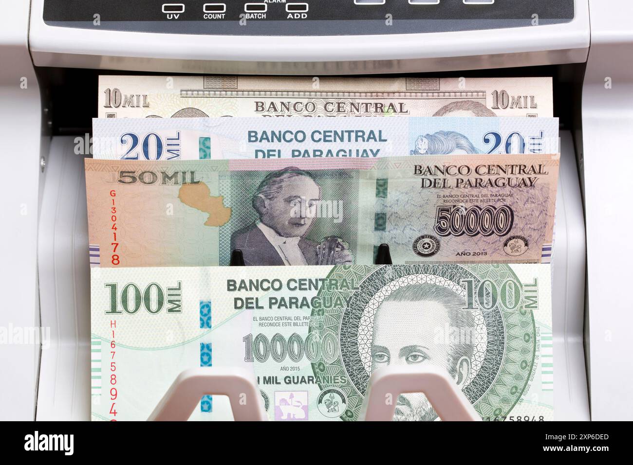 Paraguayan money - guarani in the counting machine Stock Photo - Alamy
