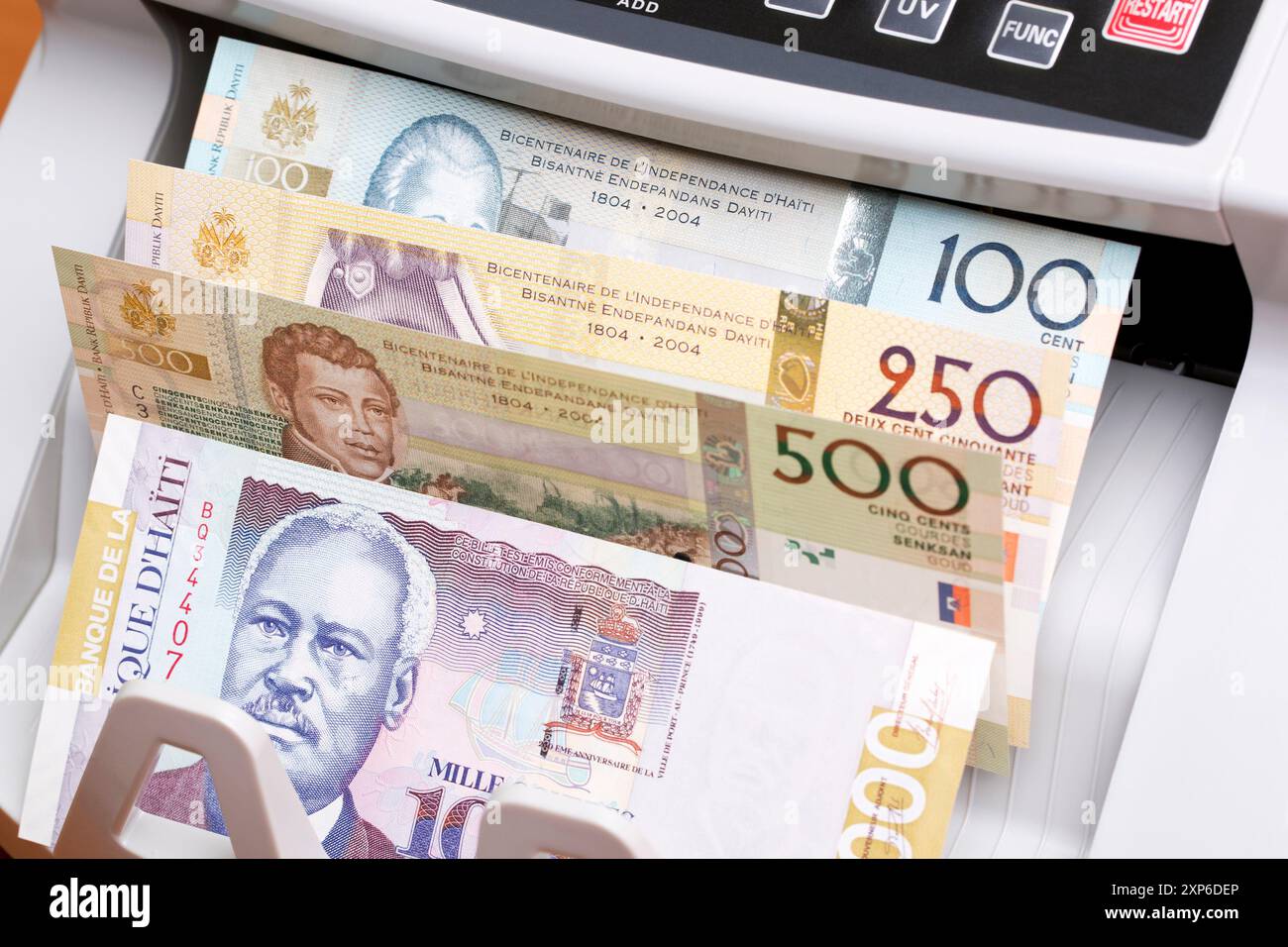 Haitian money - gourde in the counting machine Stock Photo - Alamy