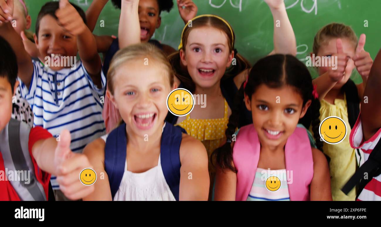 Image of falling icons over diverse school children with thumbs up in ...