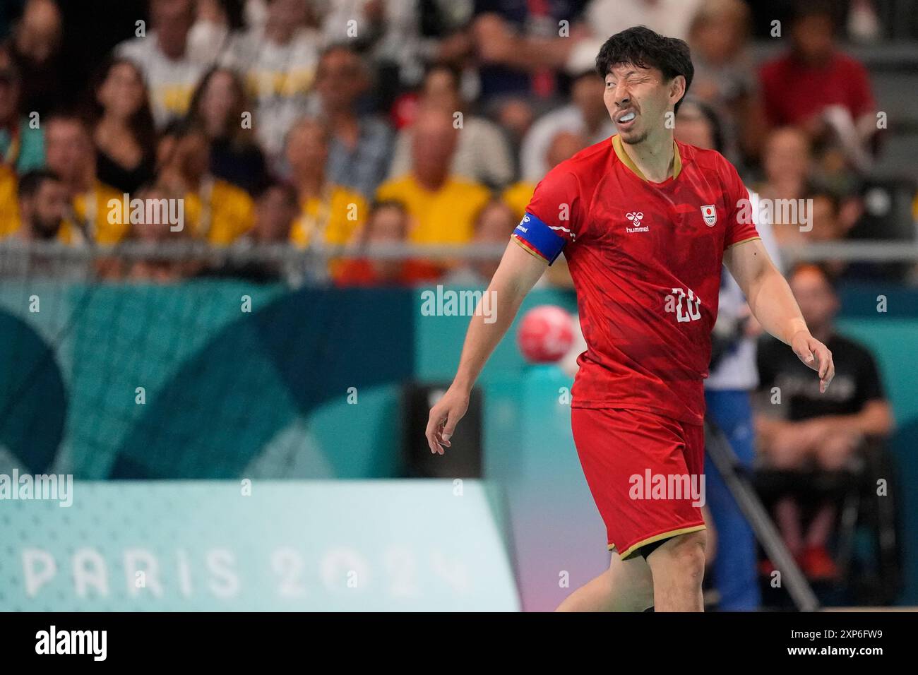 Jin Watanabe, of Japan, reacts during a men's handball match against ...