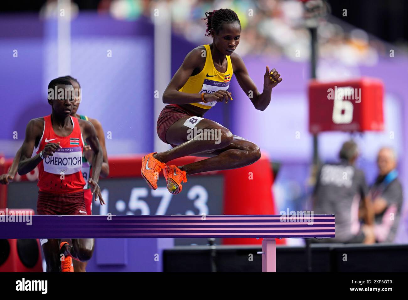 Peruth Chemutai, of Uganda, clears a hurdle in a women's 3000 meters ...