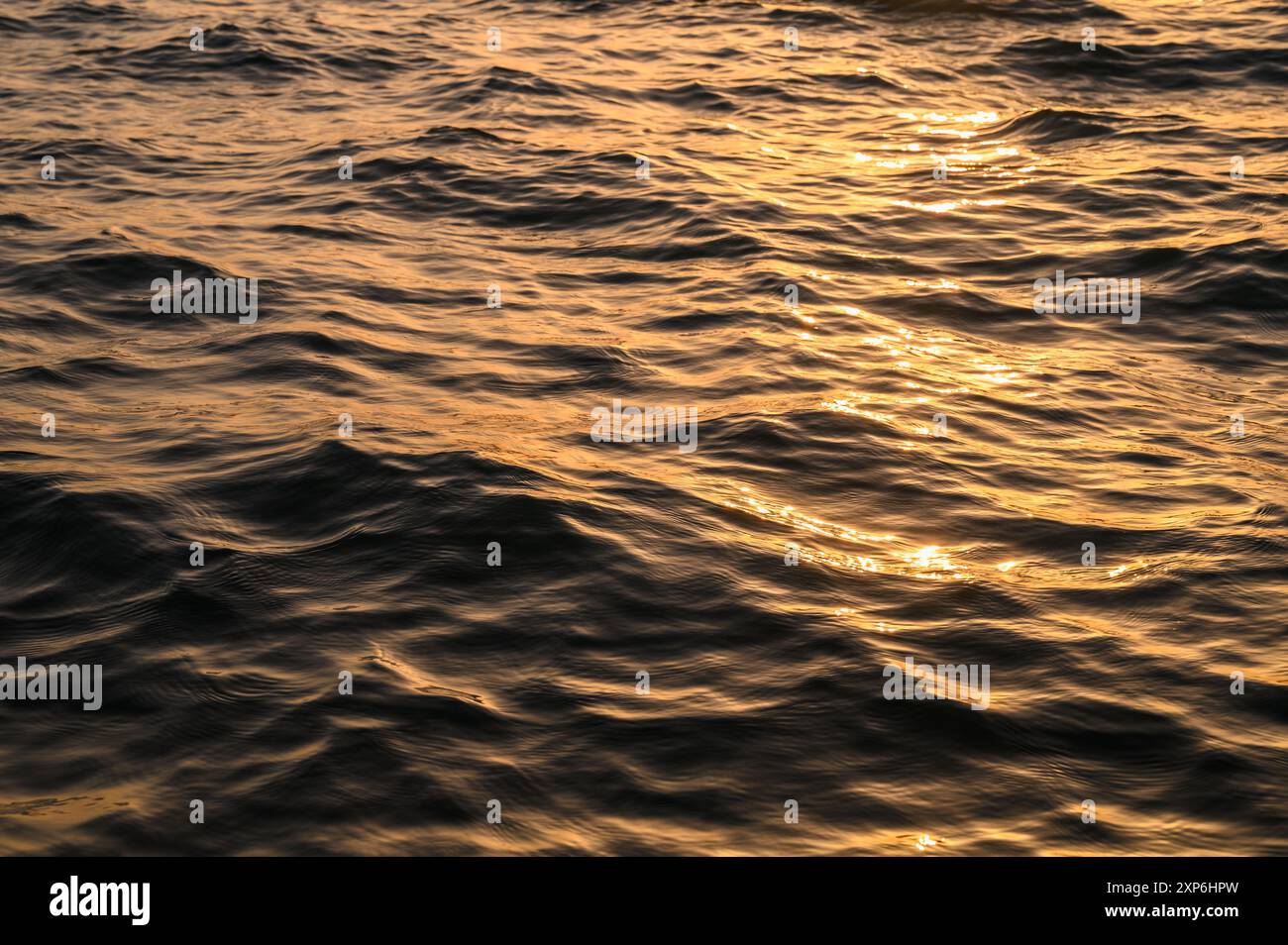 Aerial view of sunset waves on the ocean surface. Top view Stock Photo ...