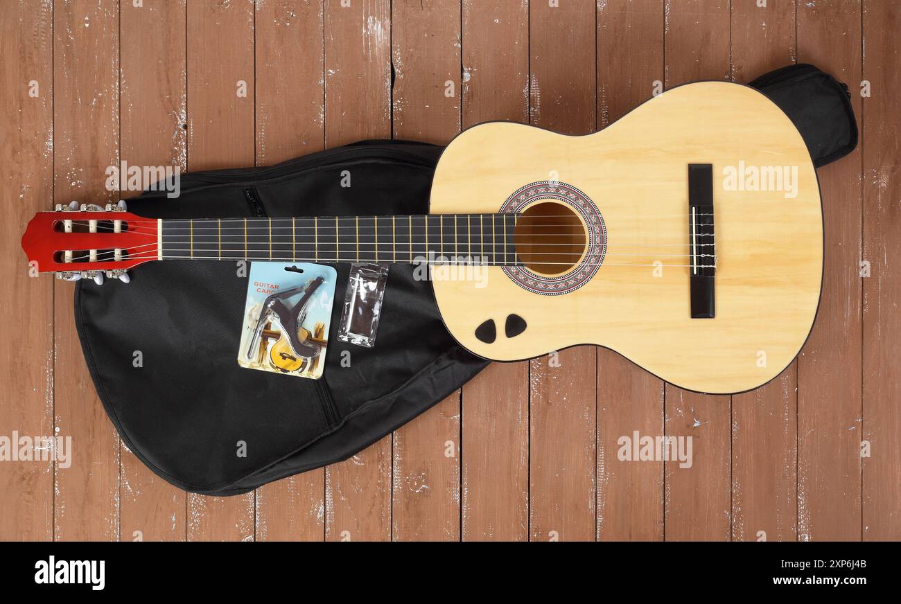 Musical instrument - Top view classic Guitar, case, capo, key, picks ...