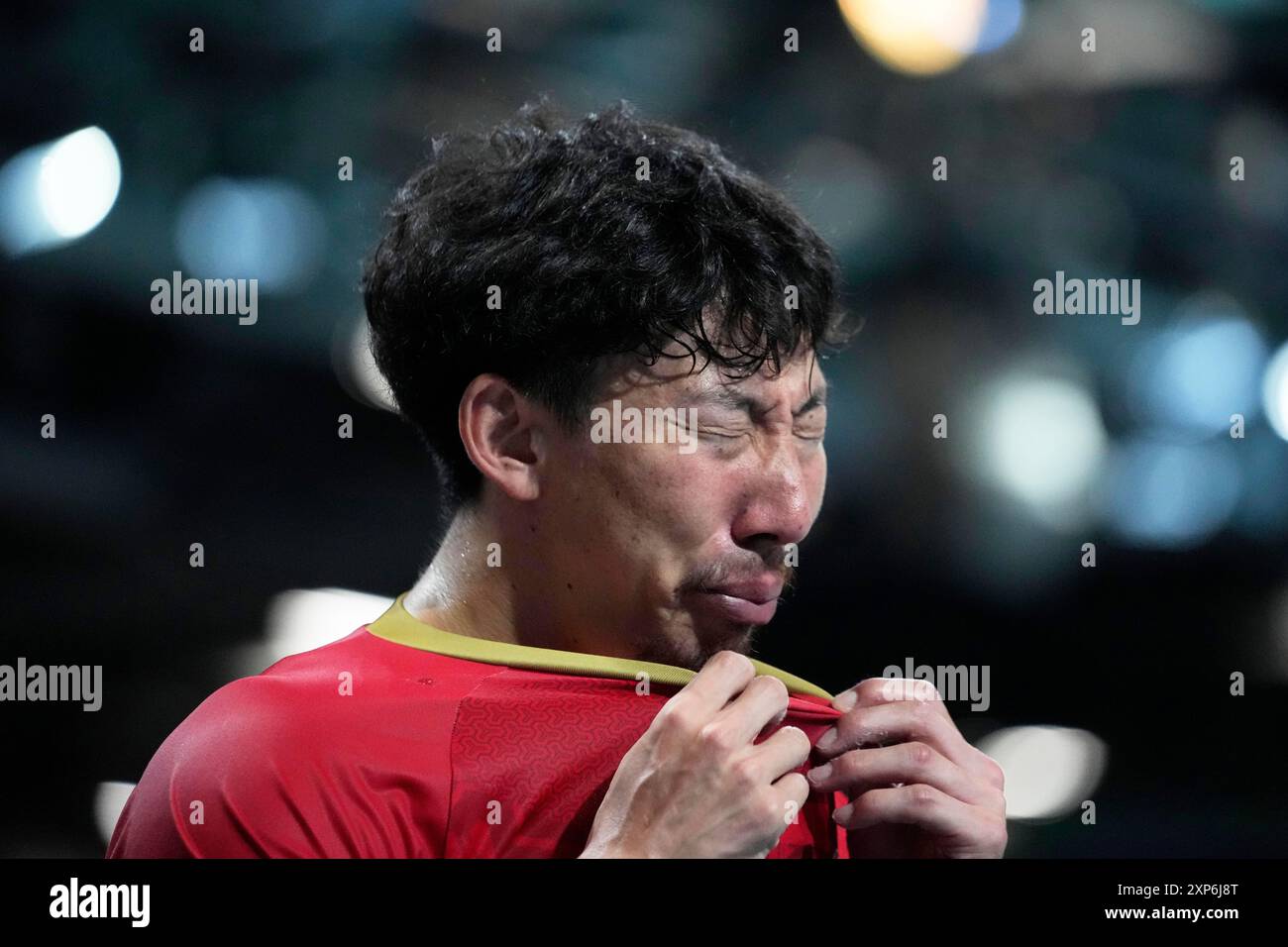 Jin Watanabe, of Japan, cries as he walks off the pitch after his team lost to Sweden, in the ...