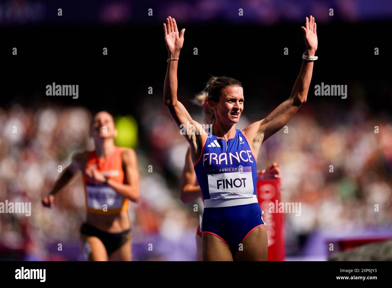 Alice Finot, of France, reacts after a heat in the women's 3000-meter ...