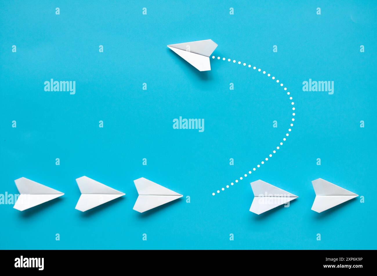White paper airplane leaving the rest of the airplanes. Customizable ...