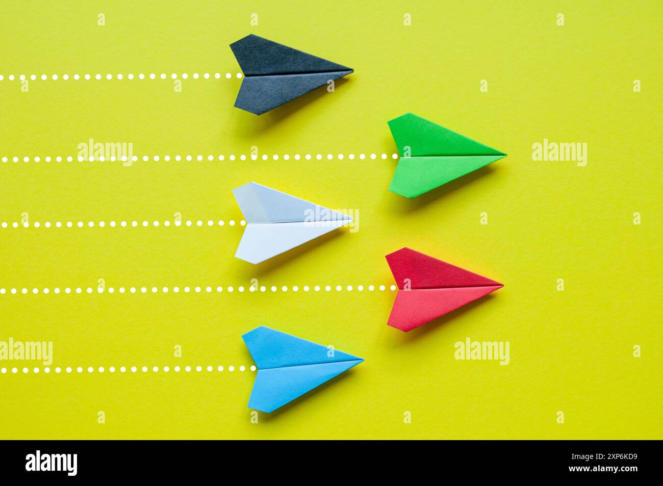 Top view of multicolored paper airplane representing diversity and ...