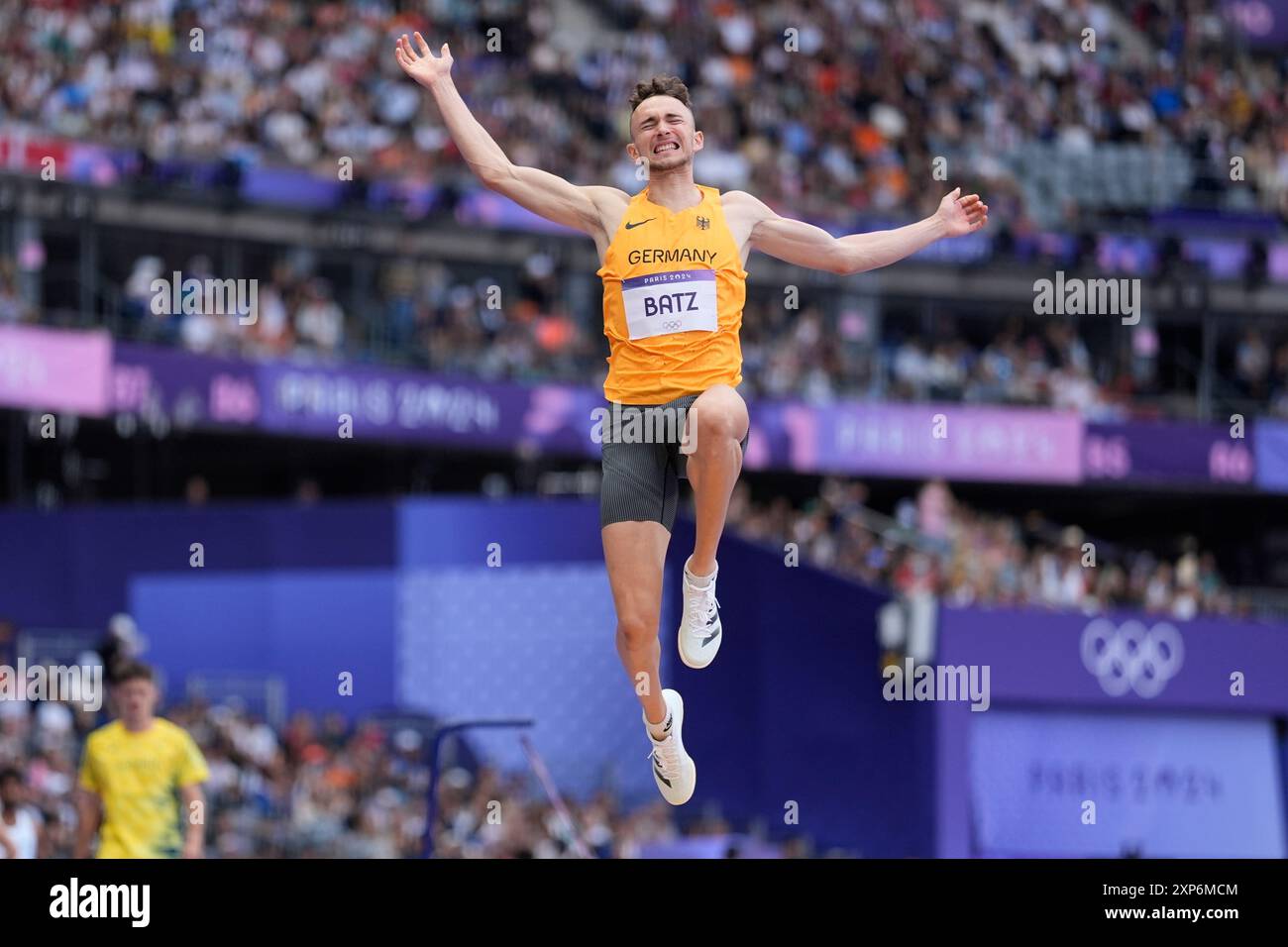 Simon Batz, of Germany, competes in the men's long jump qualification ...