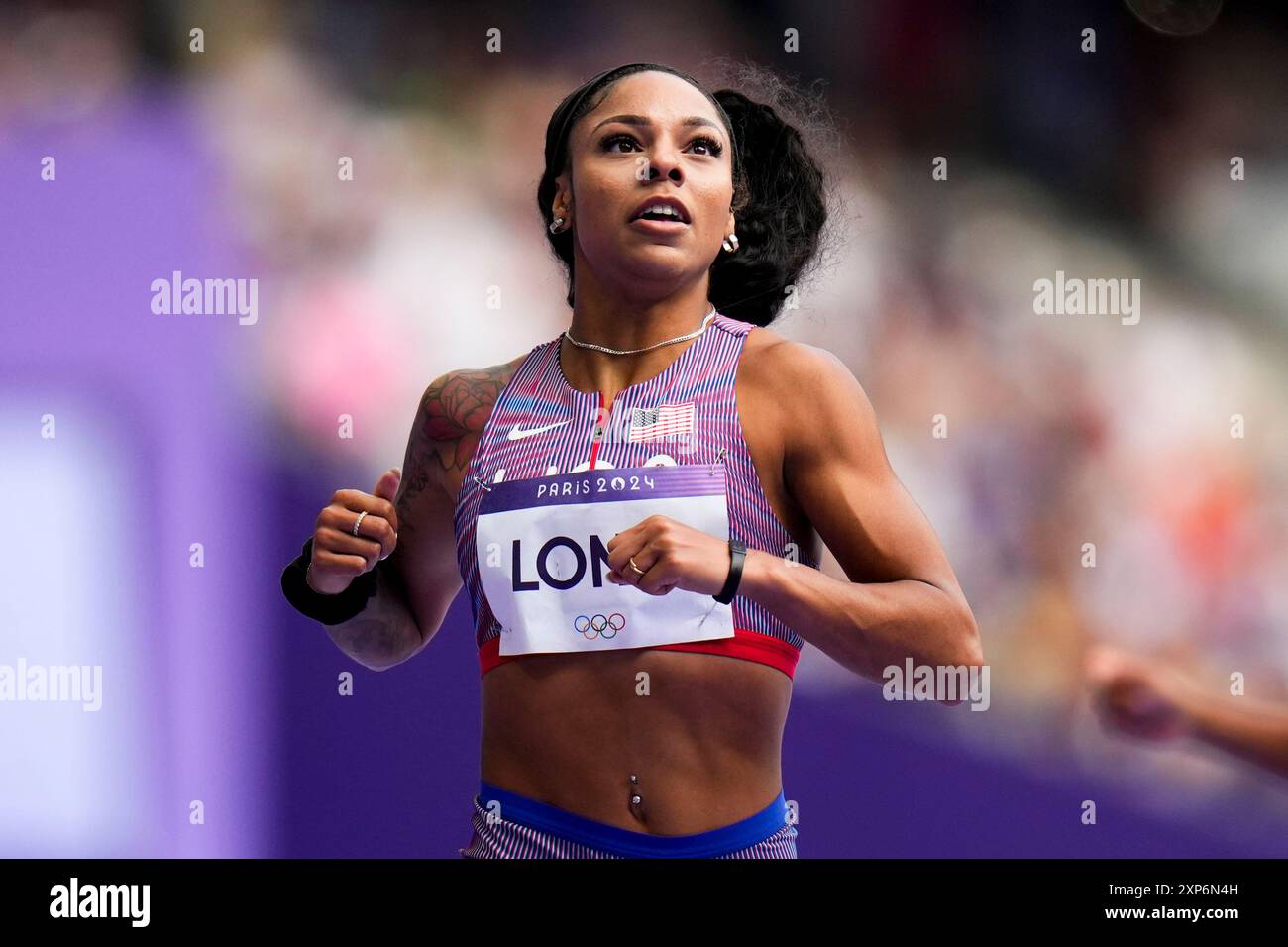 McKenzie Long, of the United States wins a heat in the women's 200 ...