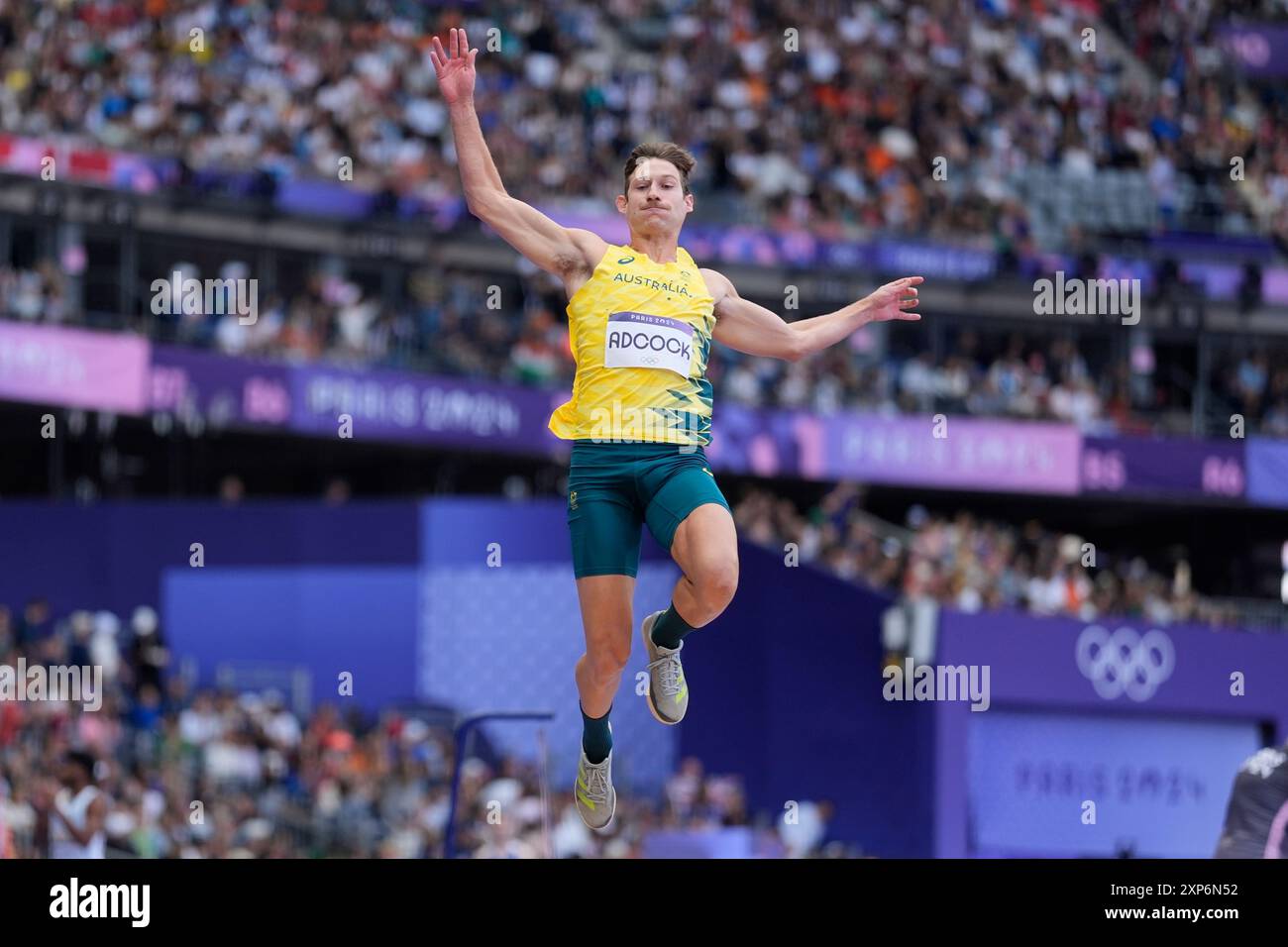 Liam Adcock, of Australia, competes in the men's long jump ...