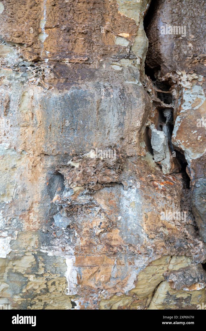 Patterns and textures of a rock wall with holes Stock Photo - Alamy