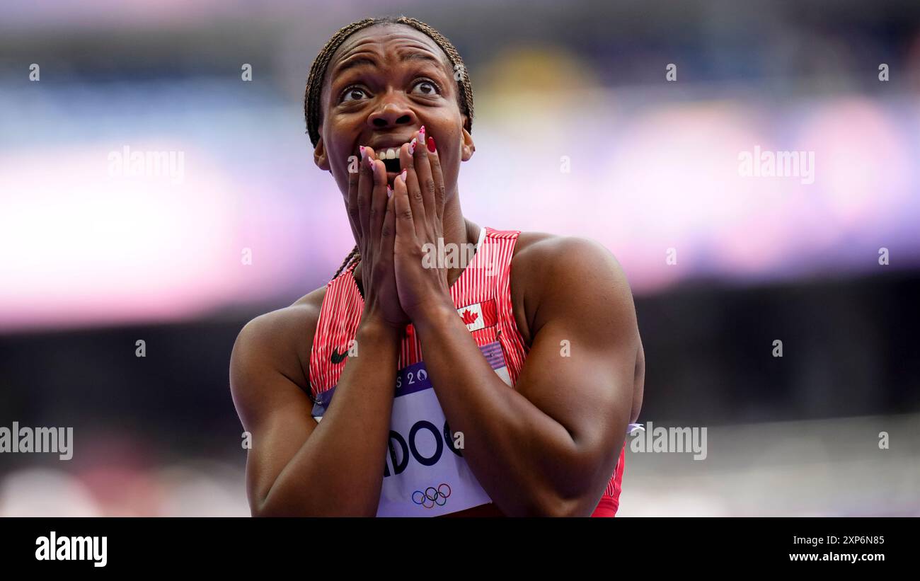 Jacqueline Madogo, of Canada, reacts after a heat in the women's 200 ...