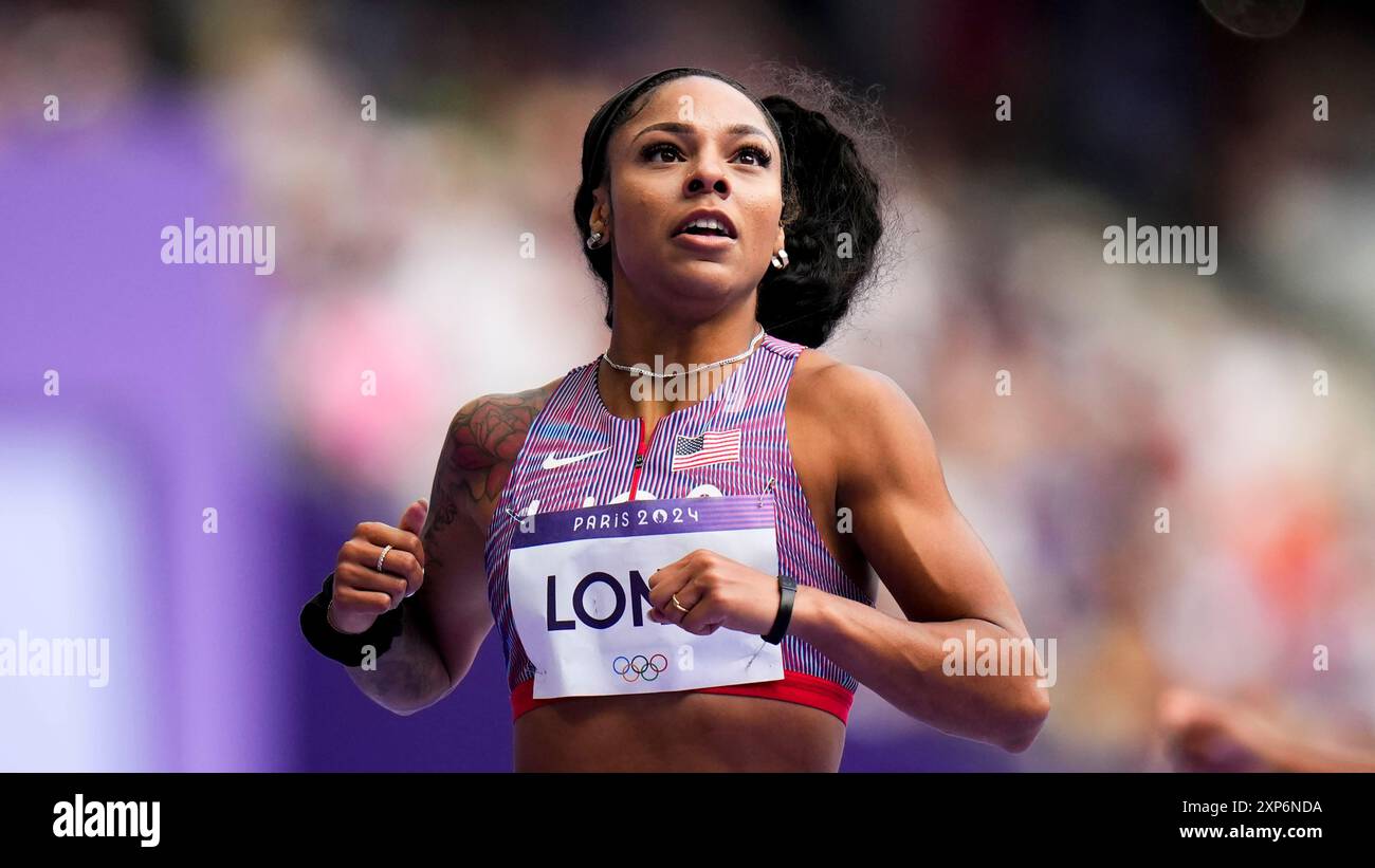 McKenzie Long, of the United States wins a heat in the women's 200 ...