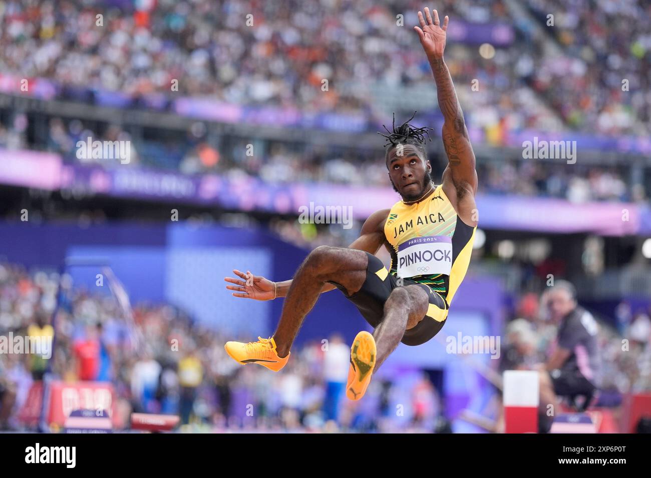 Wayne Pinnock, of Jamaica, competes in the men's long jump ...