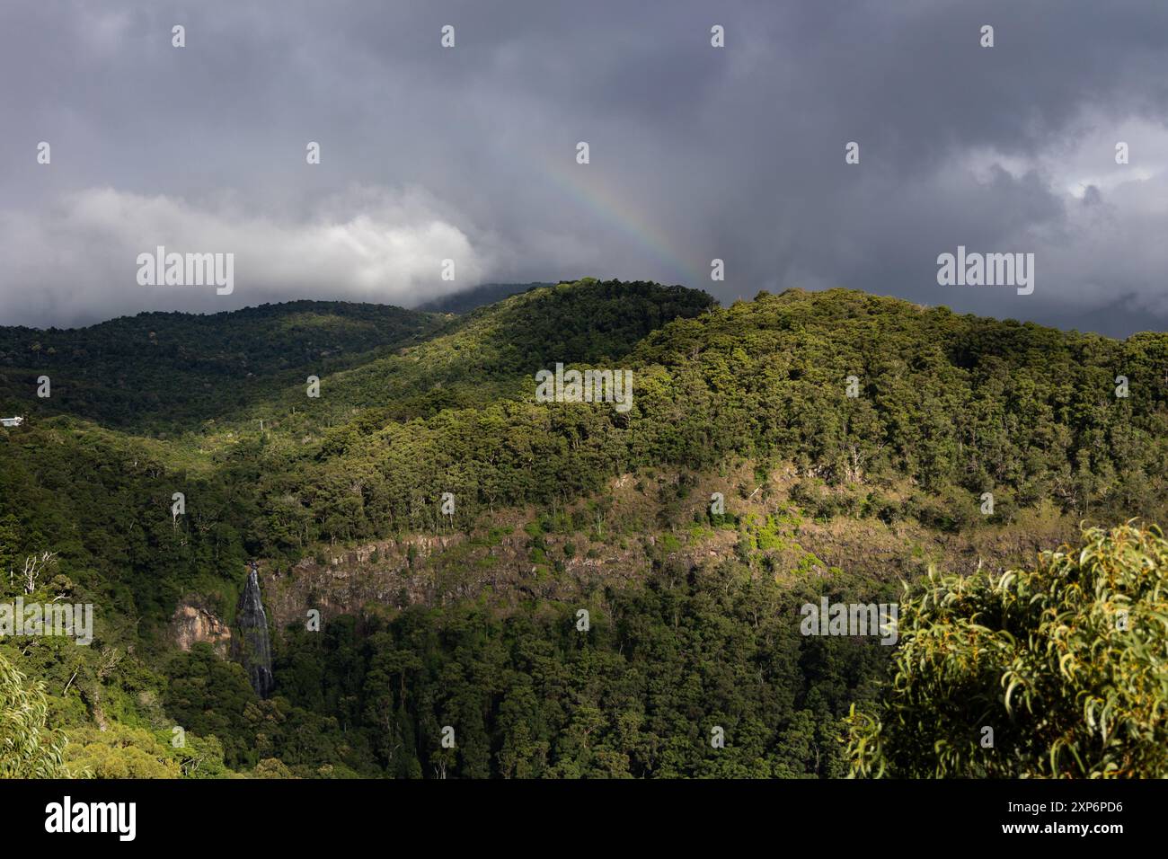 A picturesque panorama of mountains, complete with a cascading ...