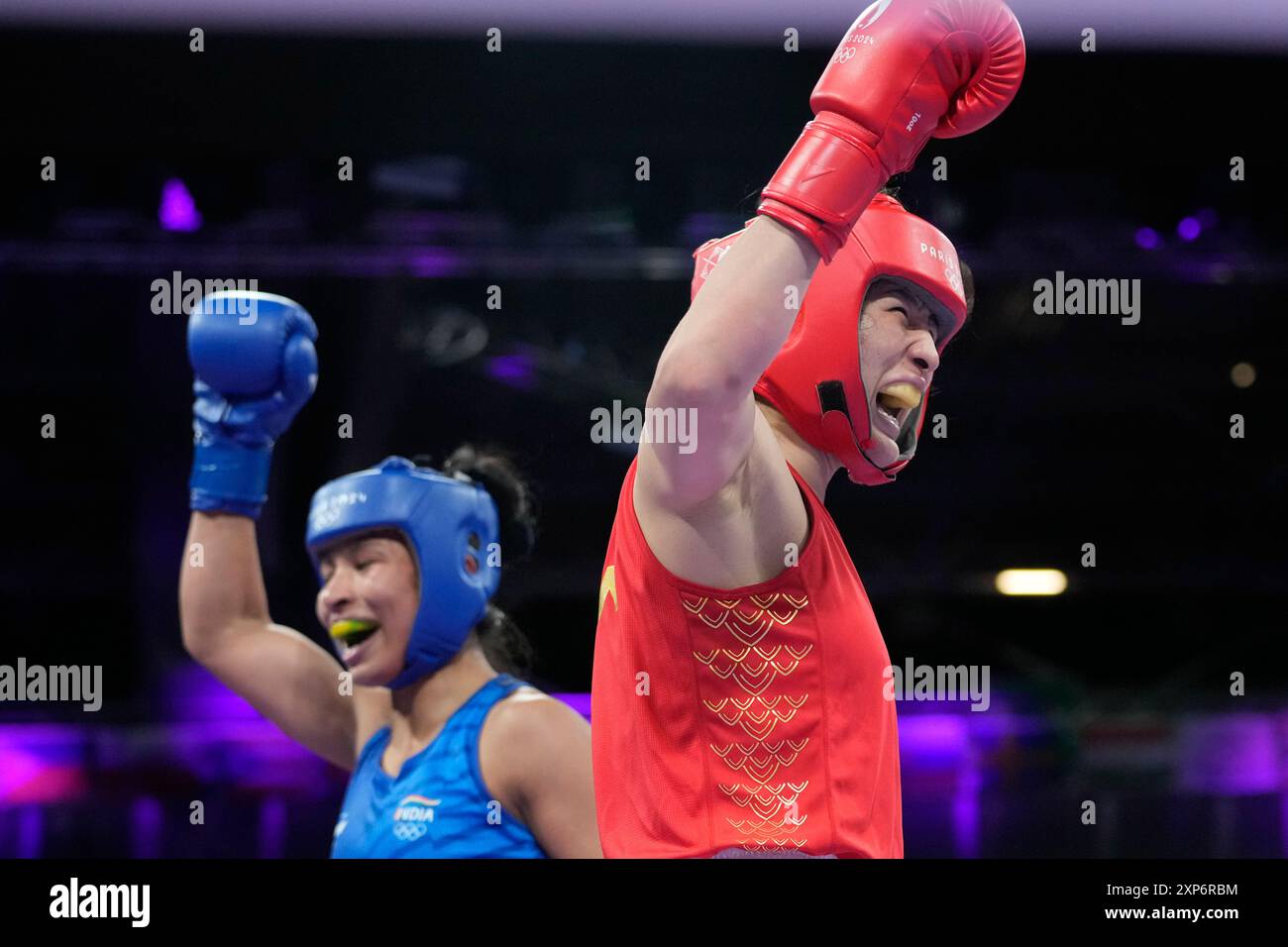 China's Li Qian celebrates after defeating India's Lovlina Borgohain in ...