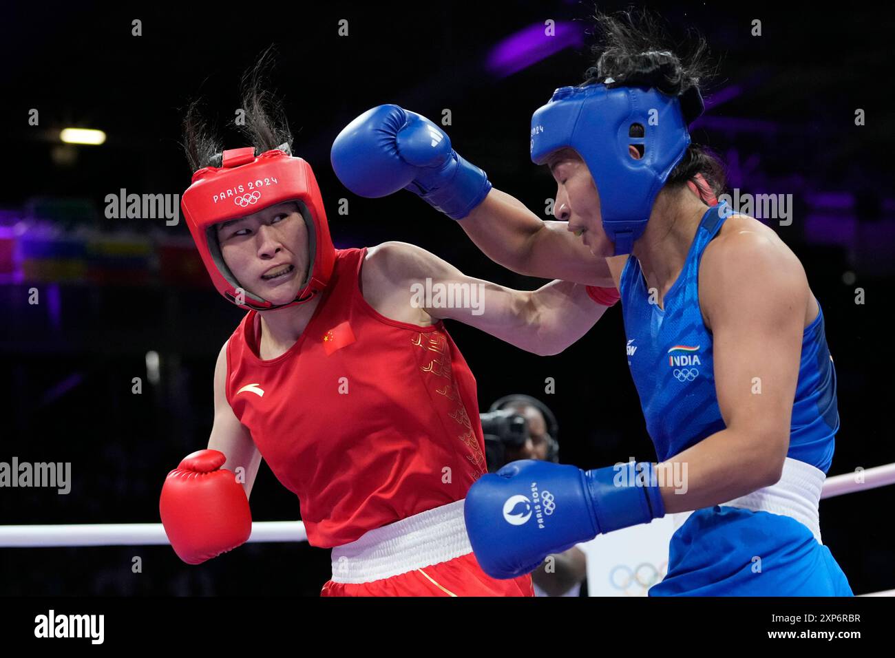 China's Li Qian, left, fights India's Lovlina Borgohain in their women ...