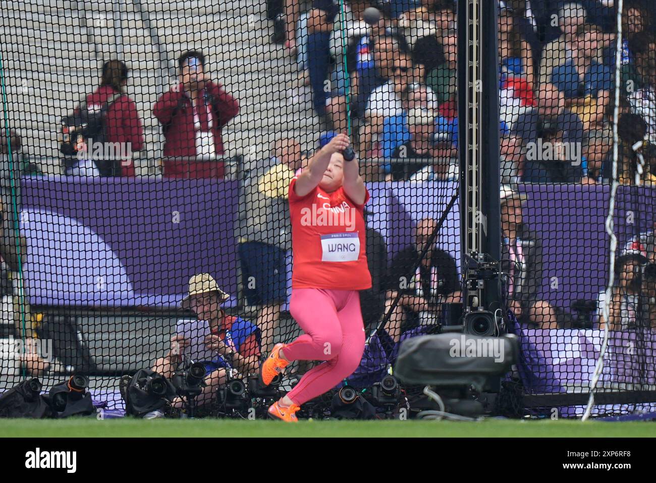 Zhao Jie, of China, competes in the women's hammer throw qualification ...
