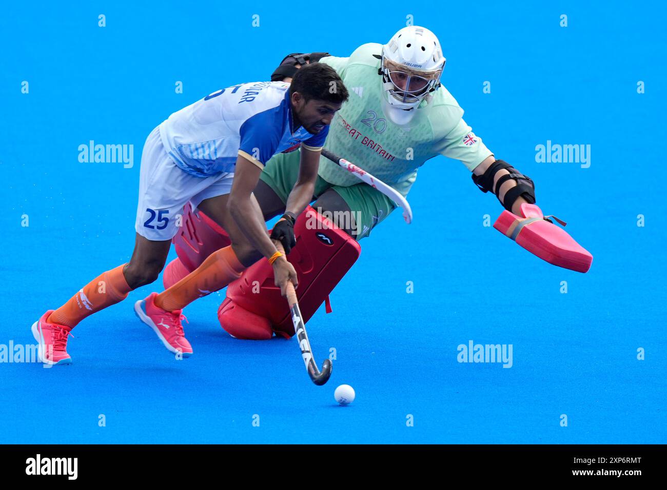 India's Rajkumar Pal, left, scores the final goal of the shoot-out to ...
