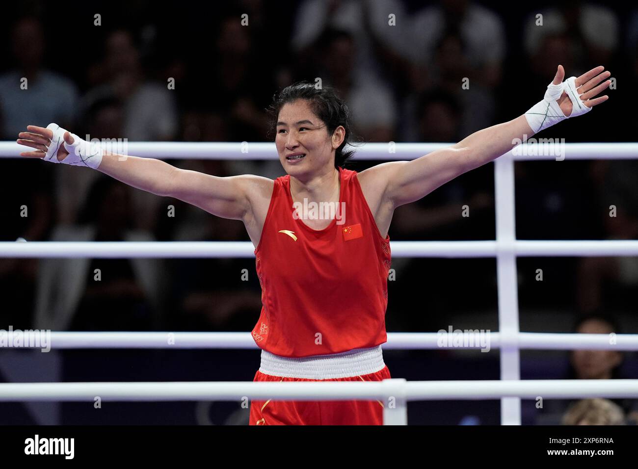China's Li Qian celebrates after defeating India's Lovlina Borgohain in ...
