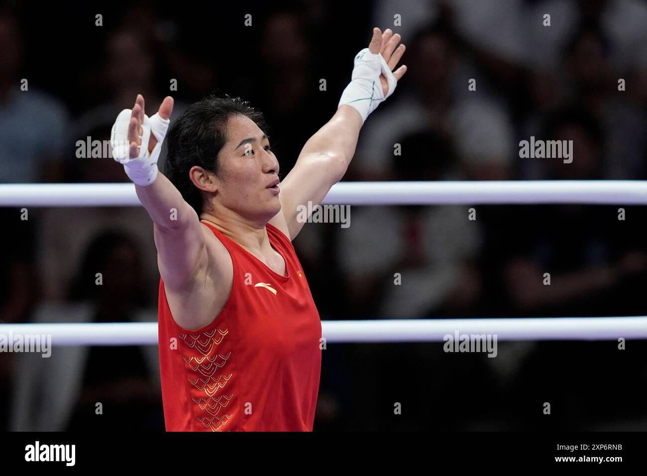 China's Li Qian celebrates after defeating India's Lovlina Borgohain in ...