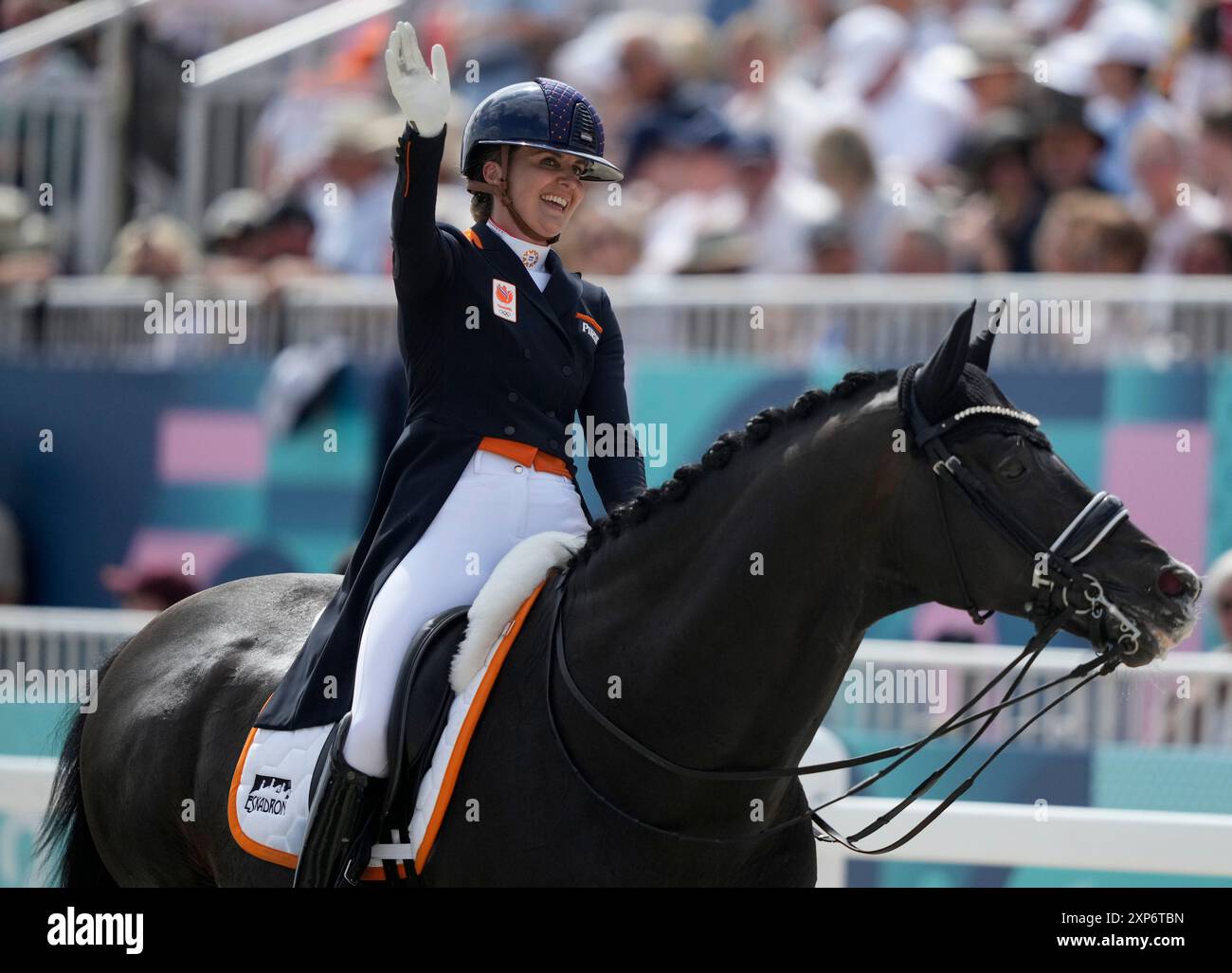 Netherlands' Emmelie Scholtens waves while riding Indian Rock during ...