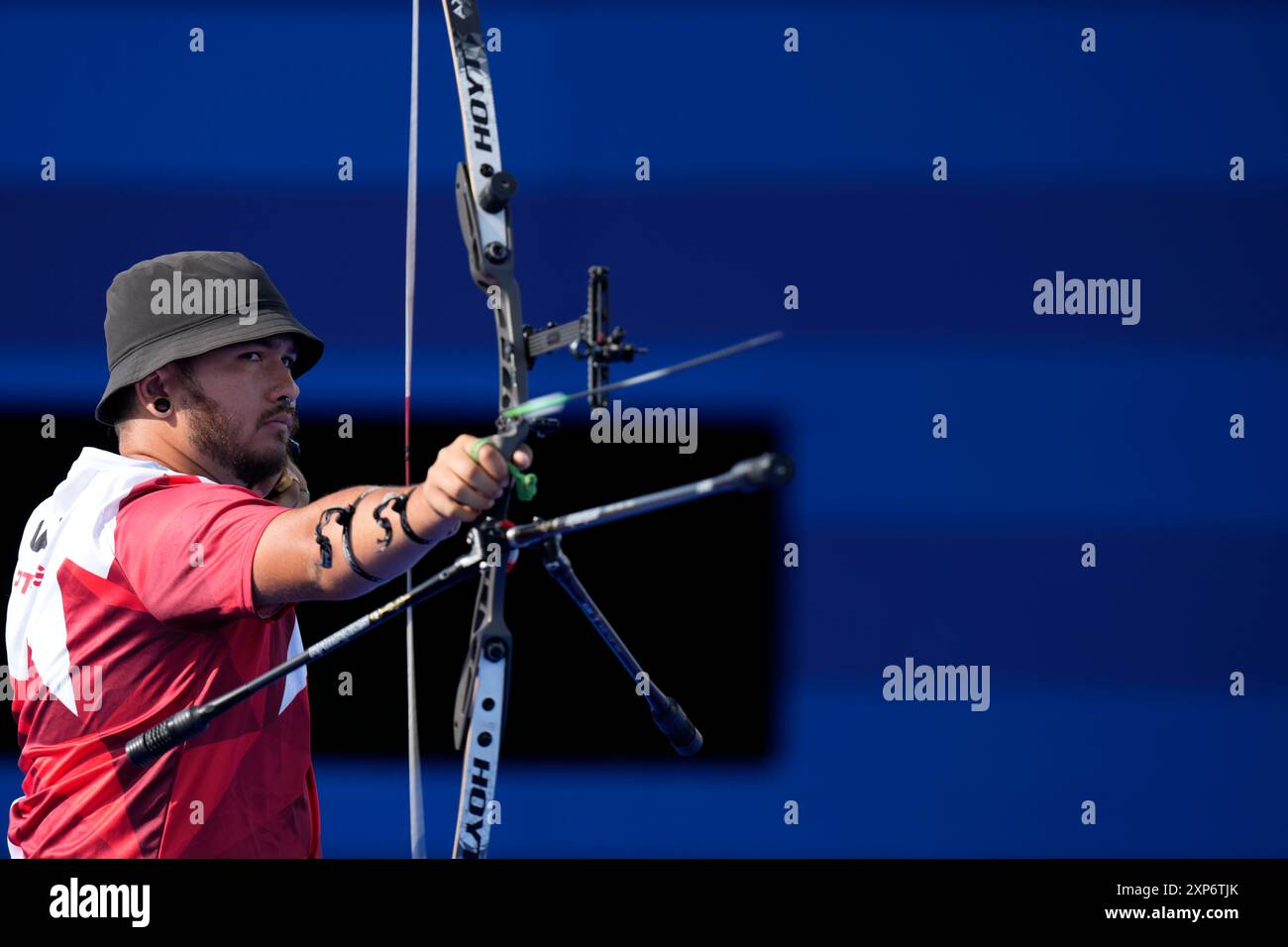 Canada's Eric Peters shoots during the Archery individual quarterfinal ...