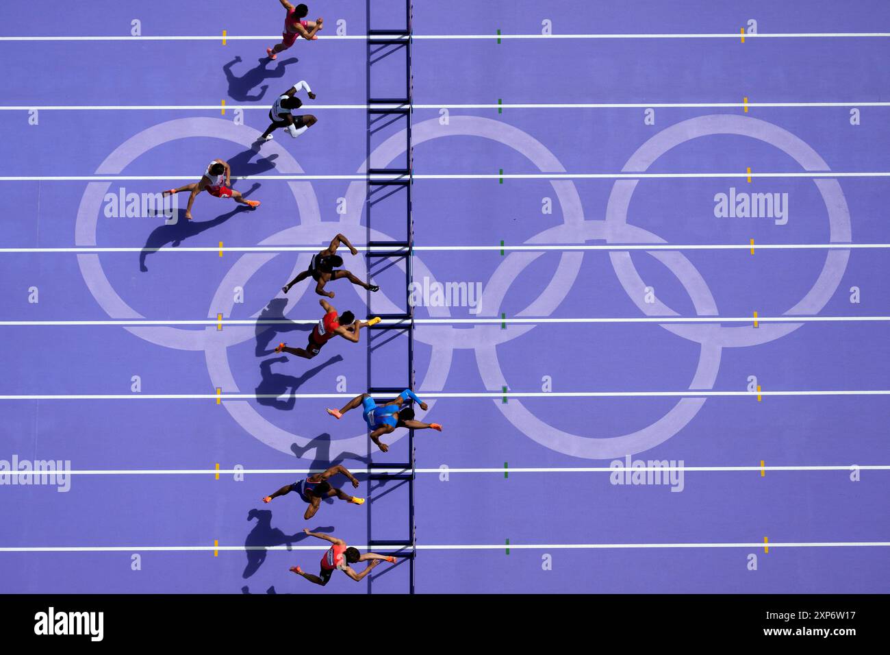 Athletes compete in a men's 110-meter hurdles heat at the 2024 Summer ...