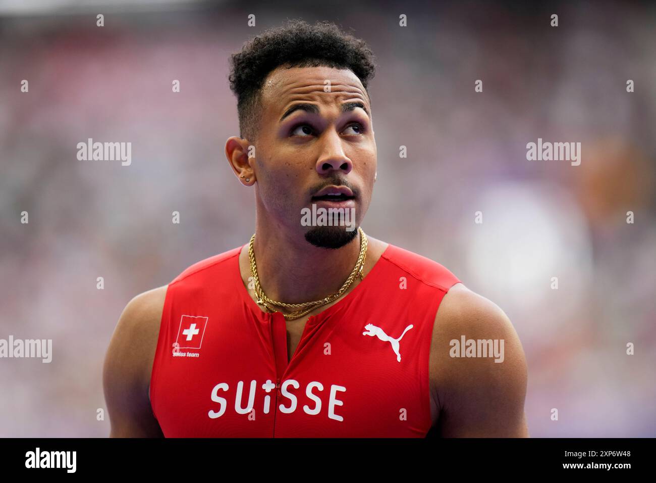 Jason Joseph, of Switzerland, wins a heat in the men's 110-meter ...