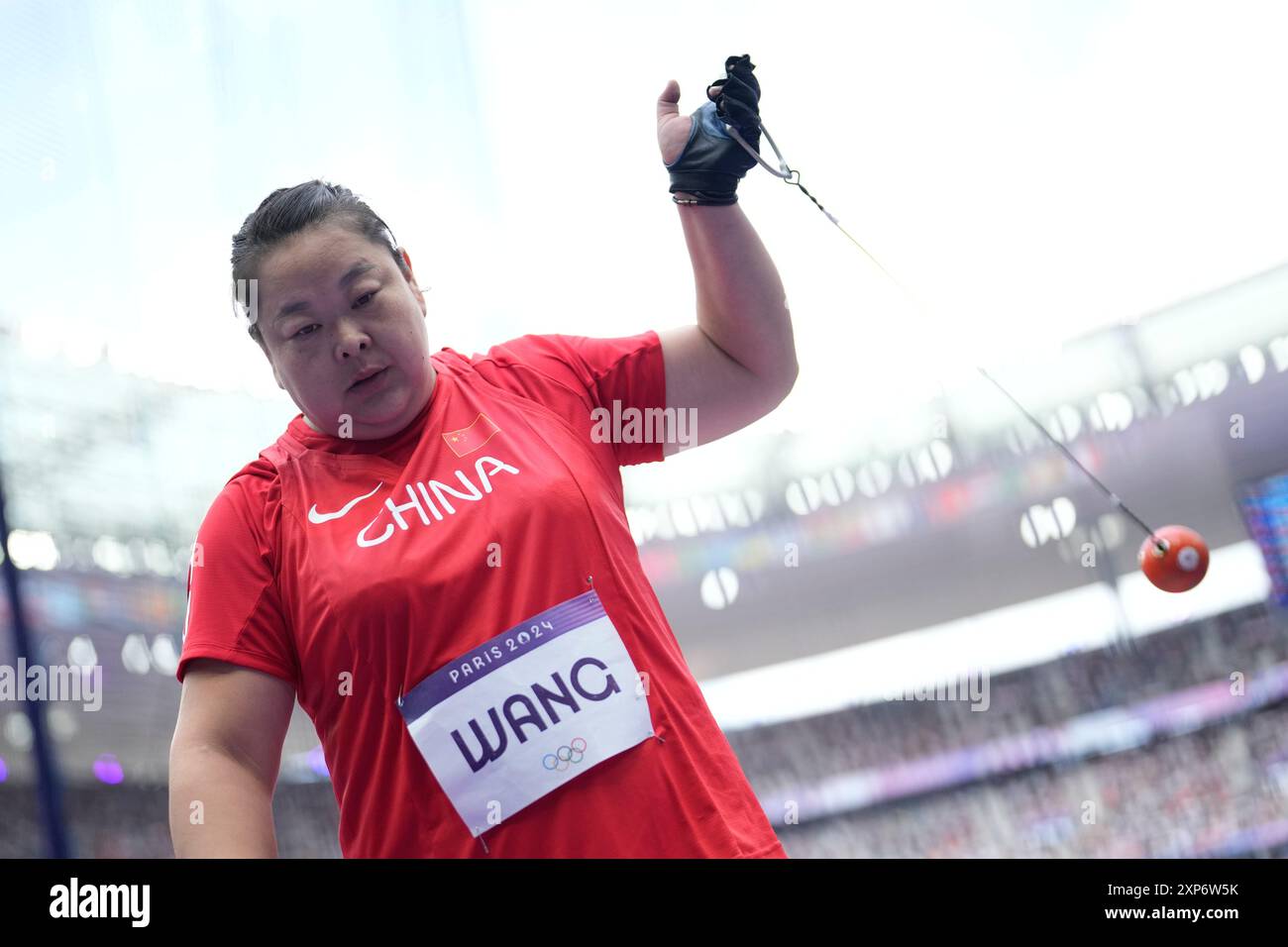 Wang Zheng, of China, competes in the women's hammer throw ...
