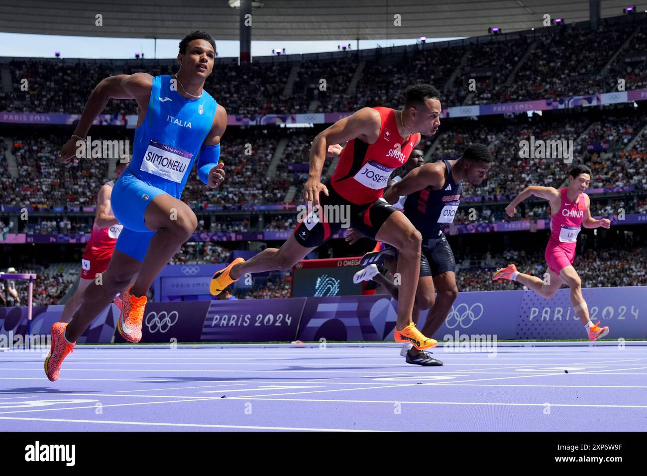Jason Joseph, of Switzerland, wins a heat in the men's 110-meter ...