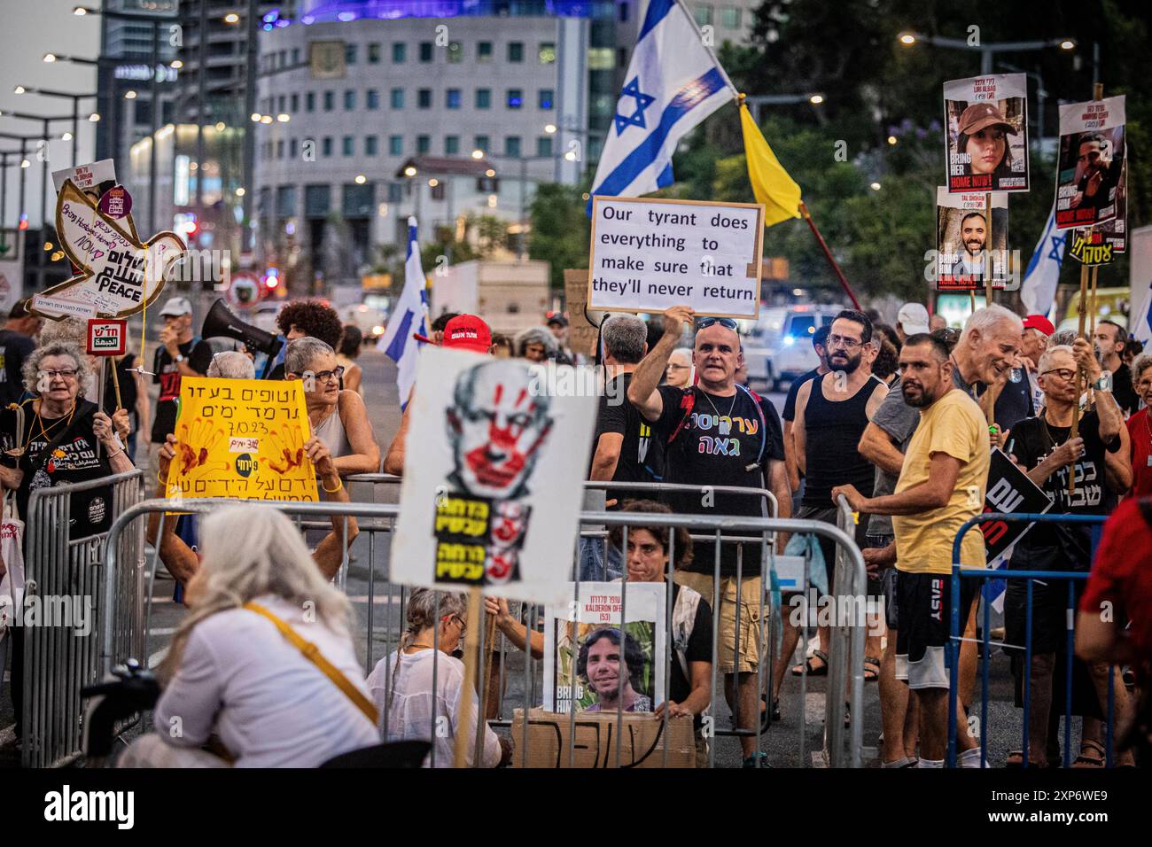 Tel Aviv, Israel. 03rd Aug, 2024. Israelis hold up signs during a rally ...