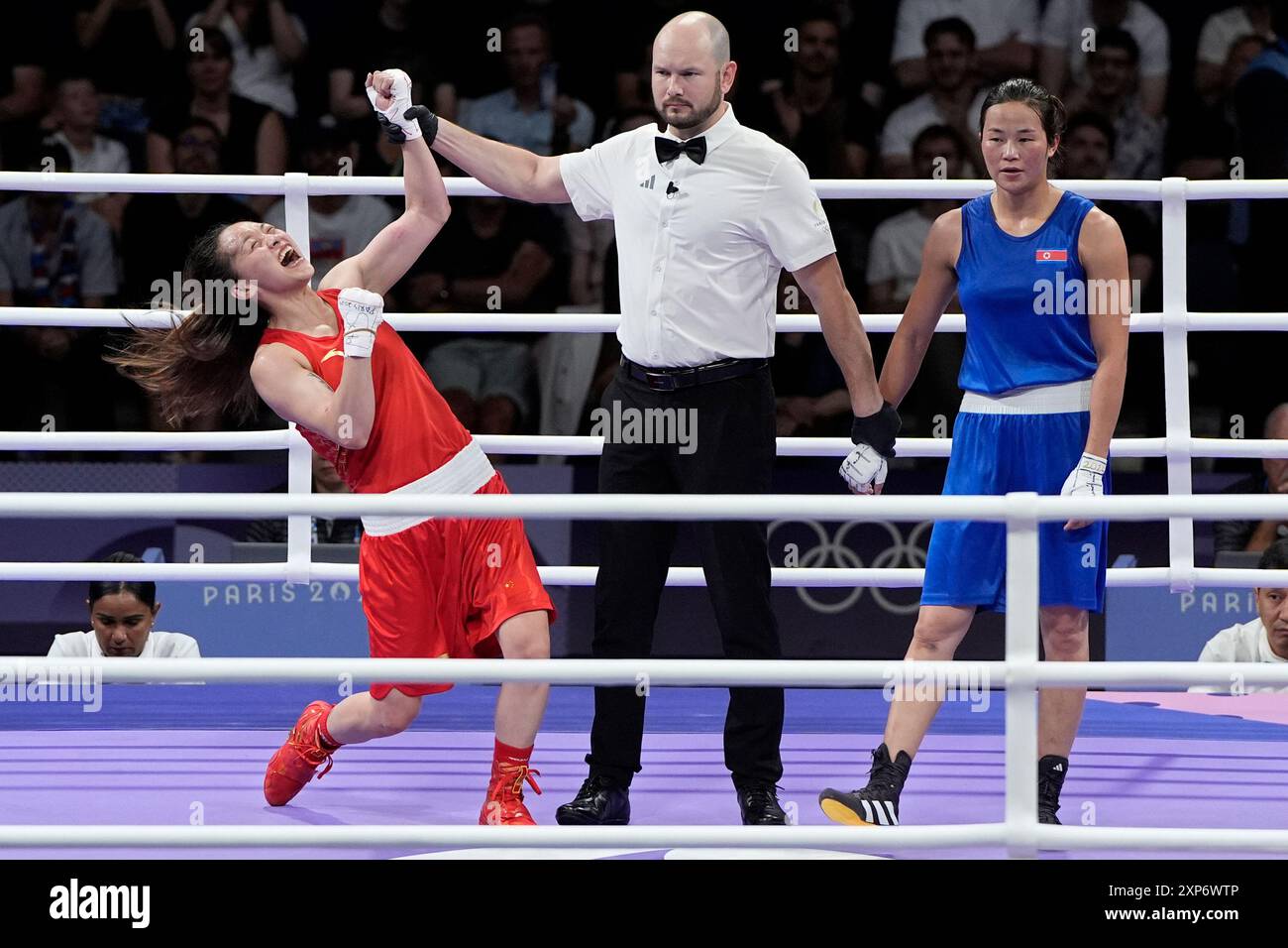 China's Chang Yuan celebrates after defeating North Korea's Pang Cholmi ...