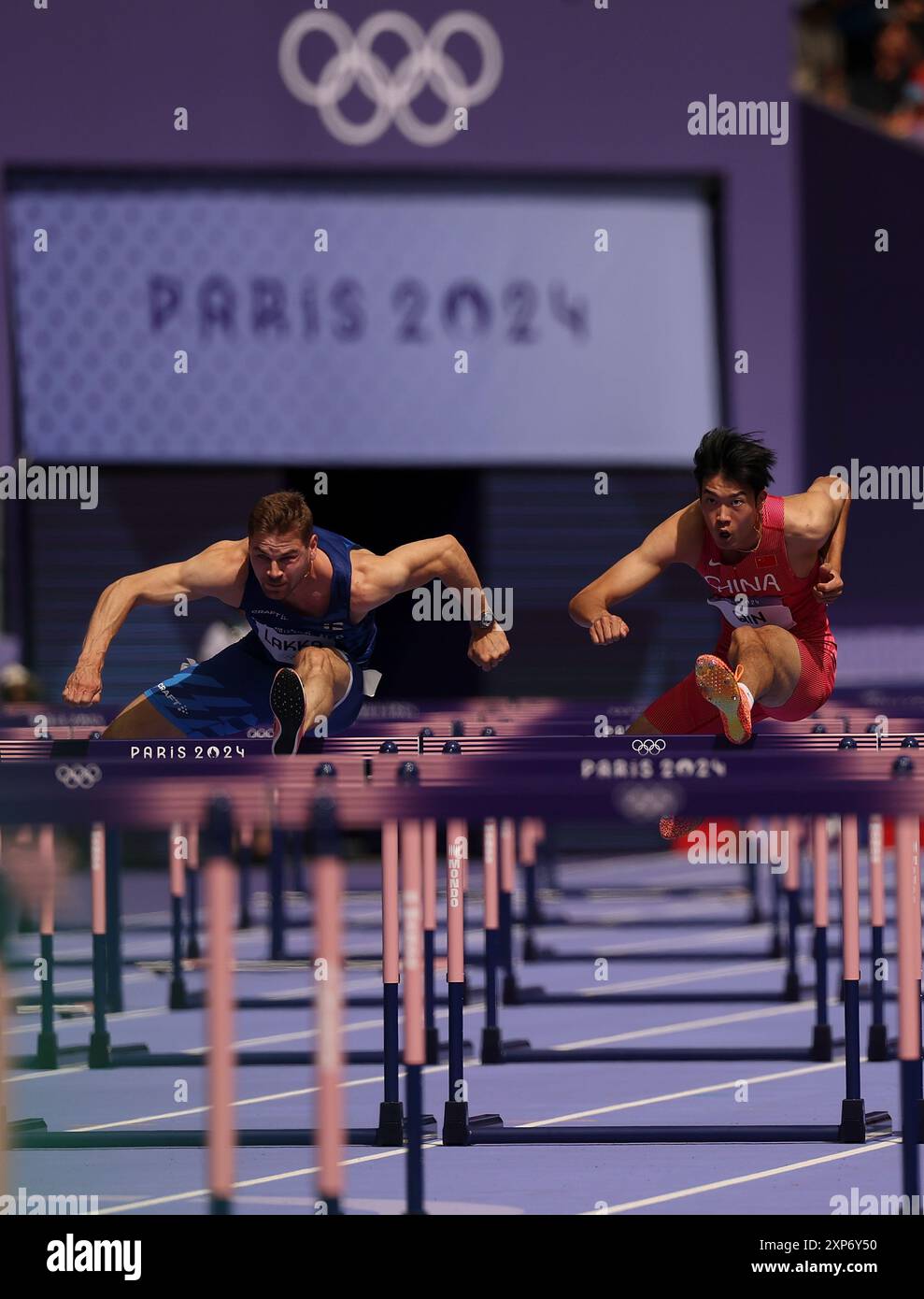 Paris, France. 4th Aug, 2024. Qin Weibo (R) of China and Elmo Lakka of ...