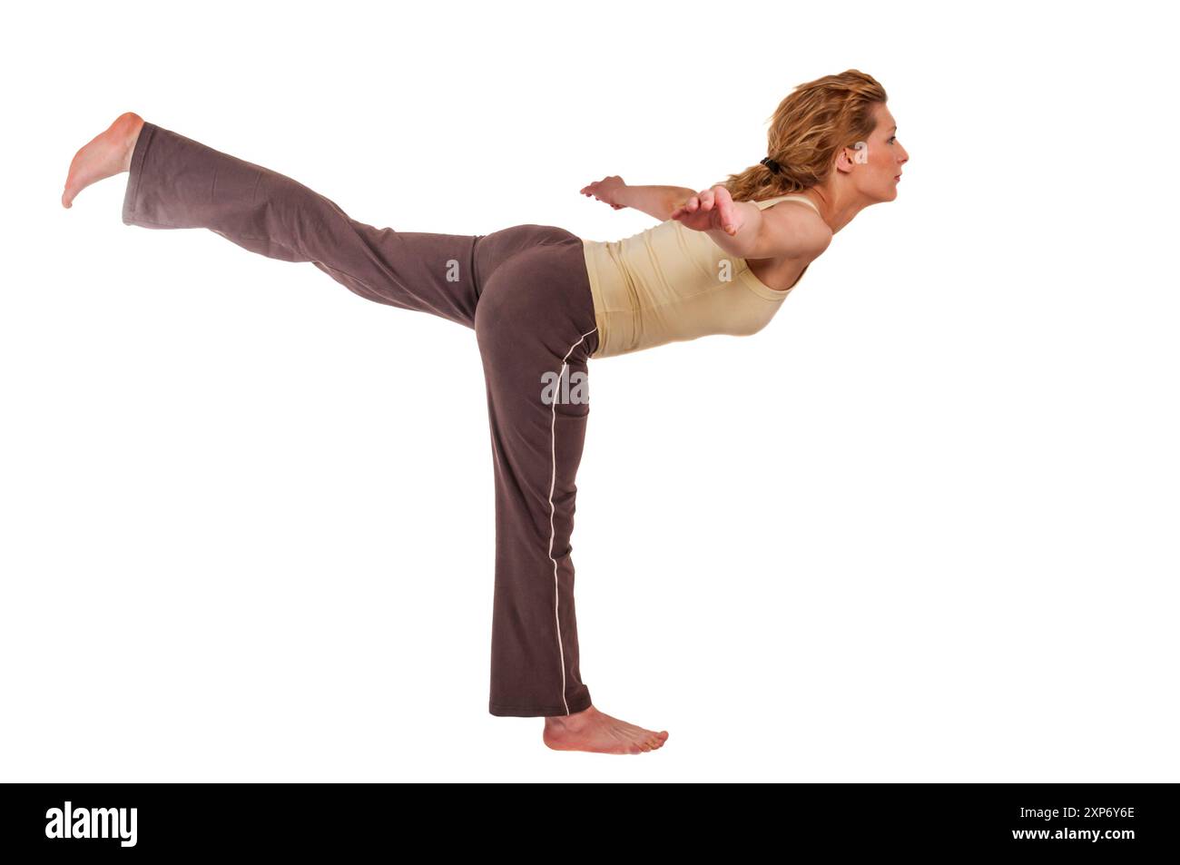 Side full body view of a young blonde woman in sportswear doing ...