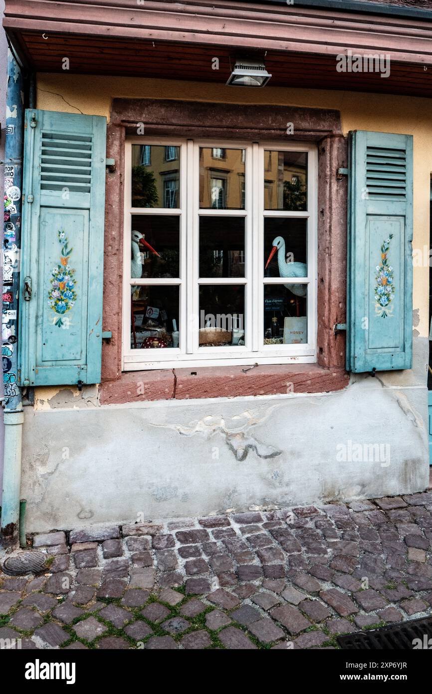 Colmar, Alsace, France. Quirky house window with storks and heron on ...