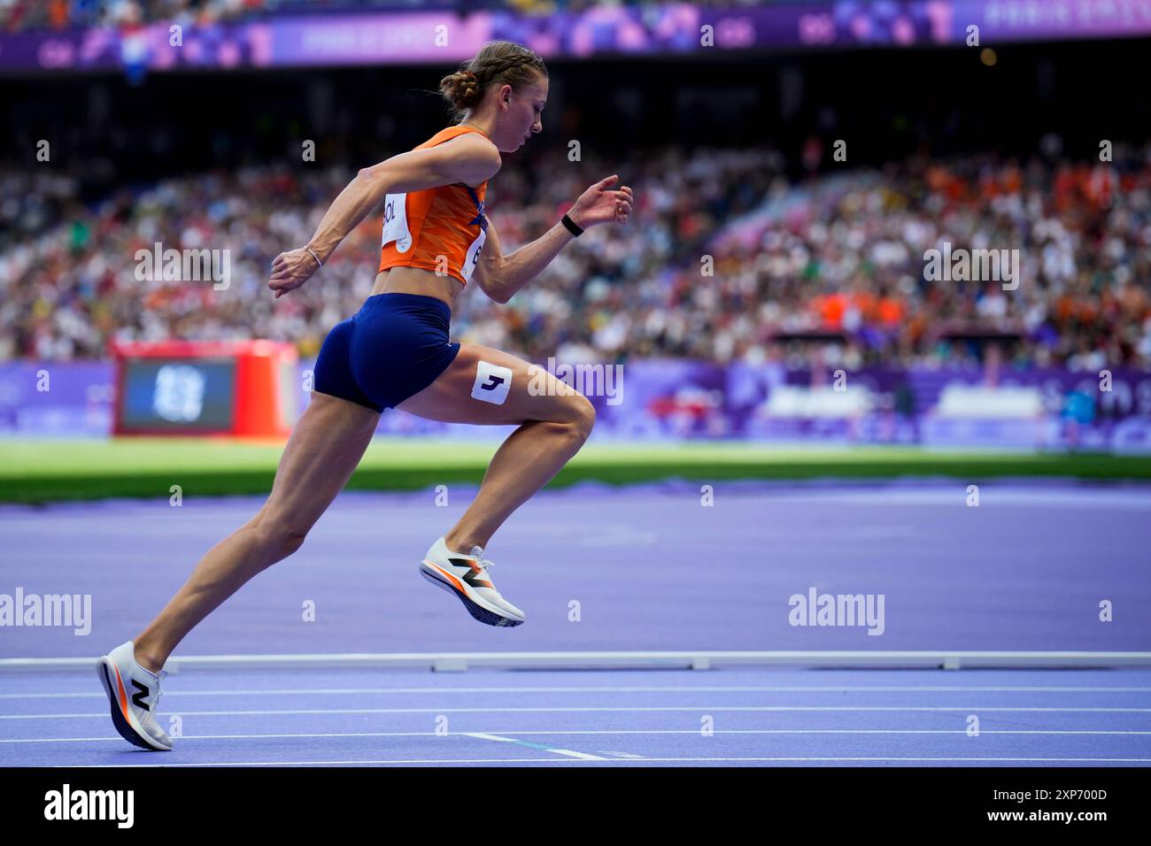 Femke Bol, of the Netherlands, competes during a heat in the women's ...